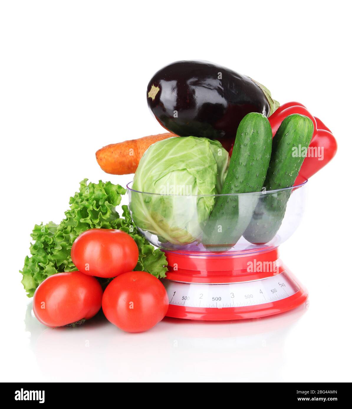 Fresh vegetables in scales isolated on white Stock Photo - Alamy