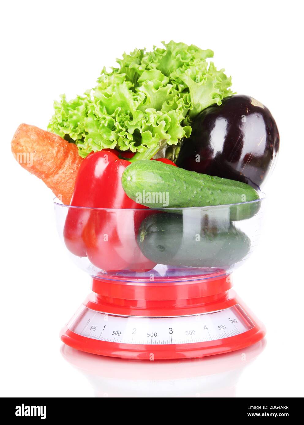 Fresh vegetables in scales isolated on white Stock Photo - Alamy