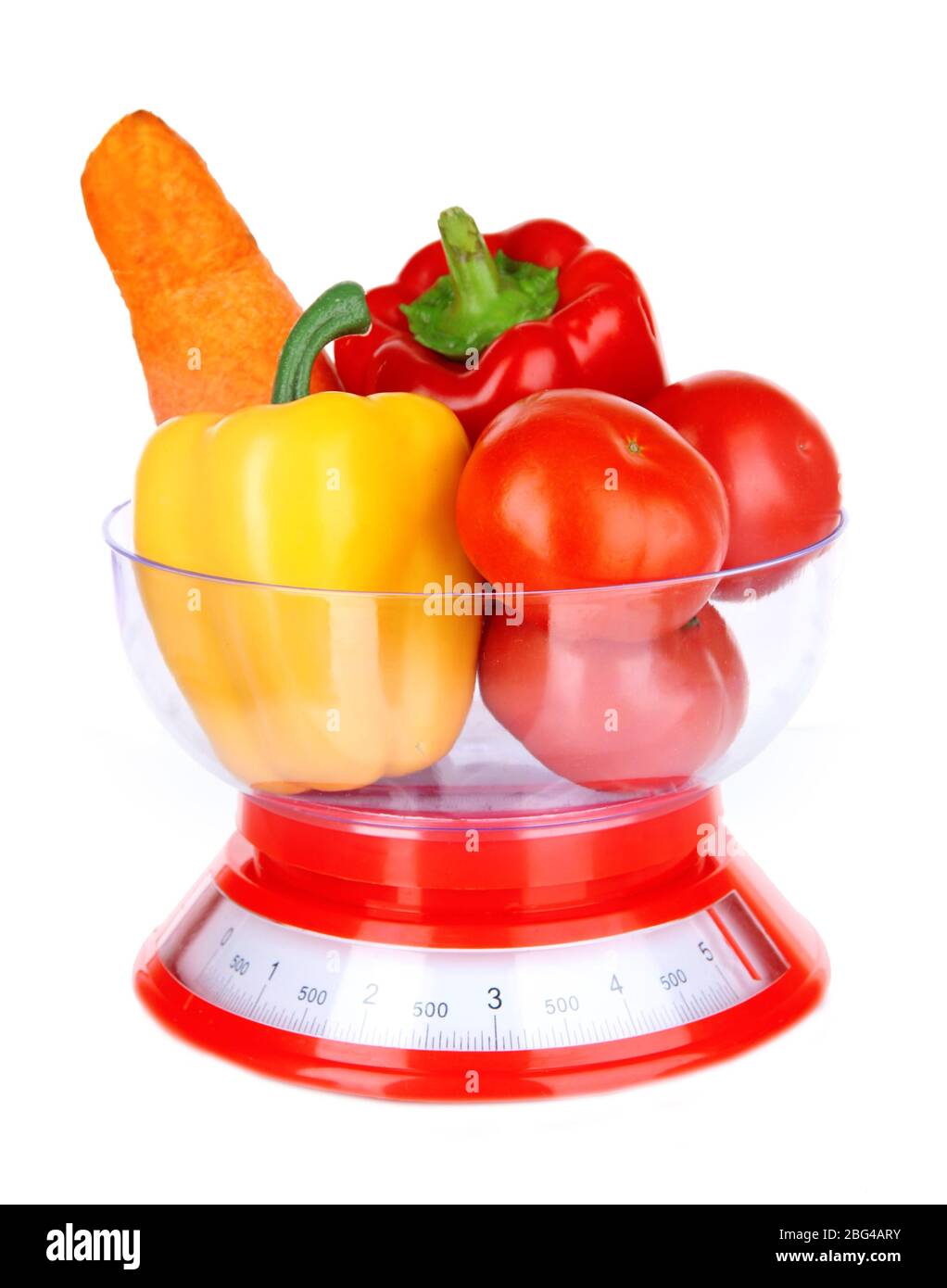 Fresh vegetables in scales isolated on white Stock Photo - Alamy