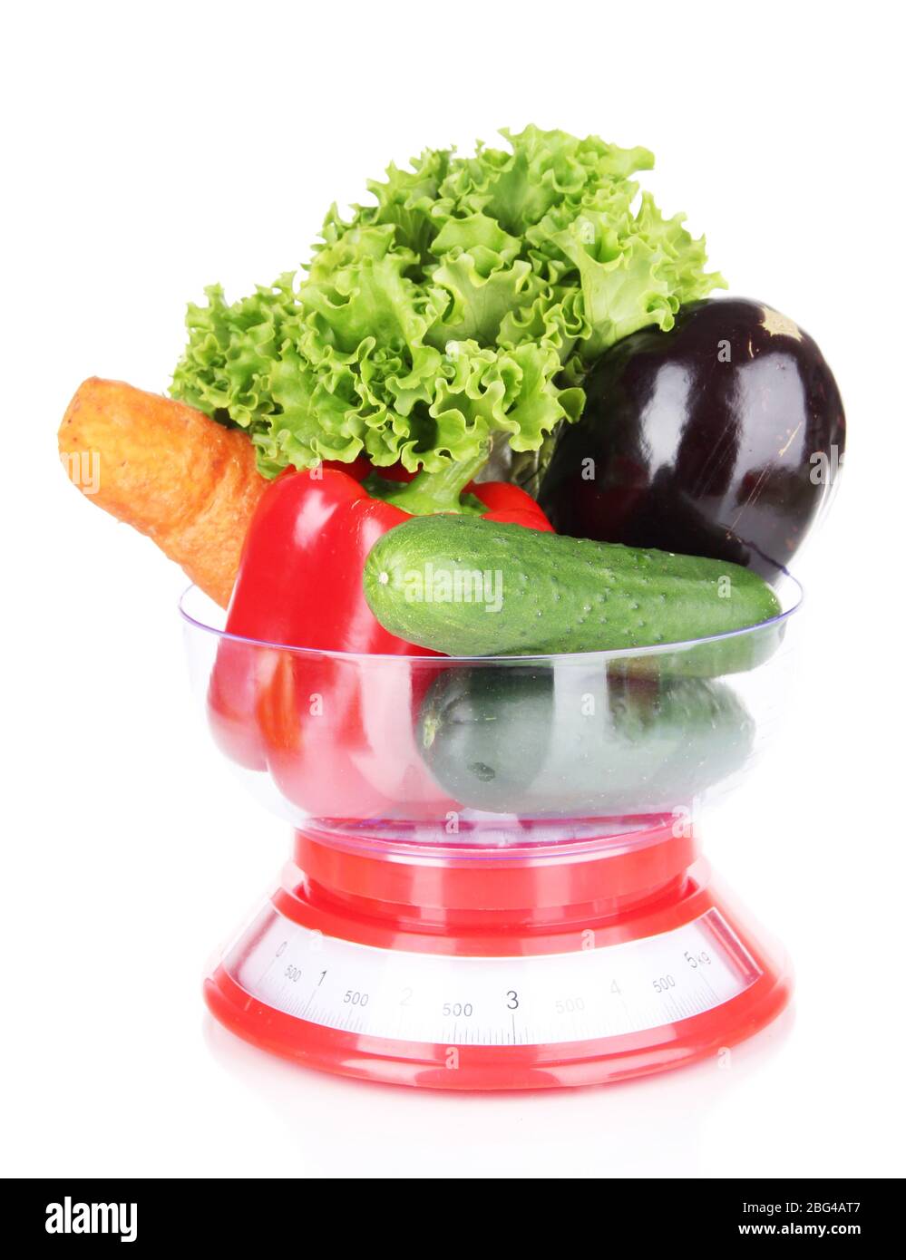 Fresh vegetables in scales isolated on white Stock Photo - Alamy