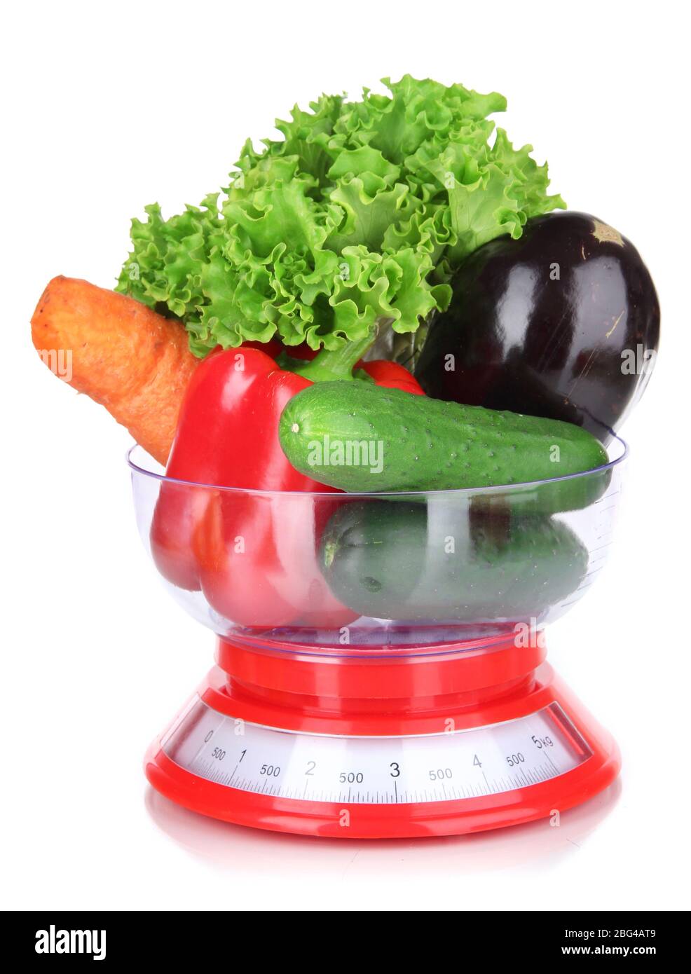 Fresh vegetables in scales isolated on white Stock Photo - Alamy