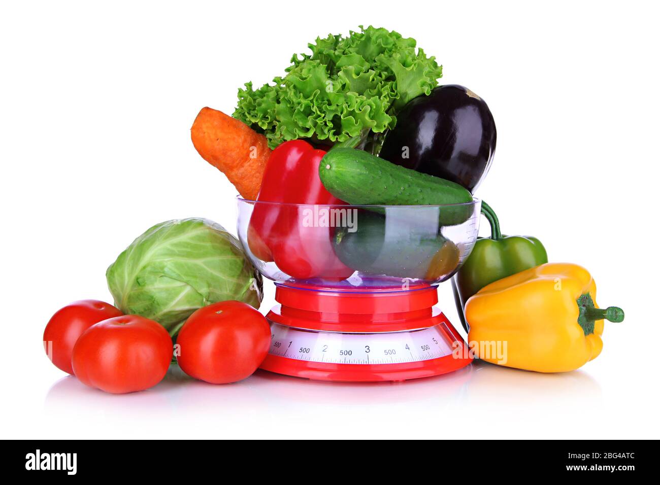 Fresh vegetables in scales isolated on white Stock Photo - Alamy