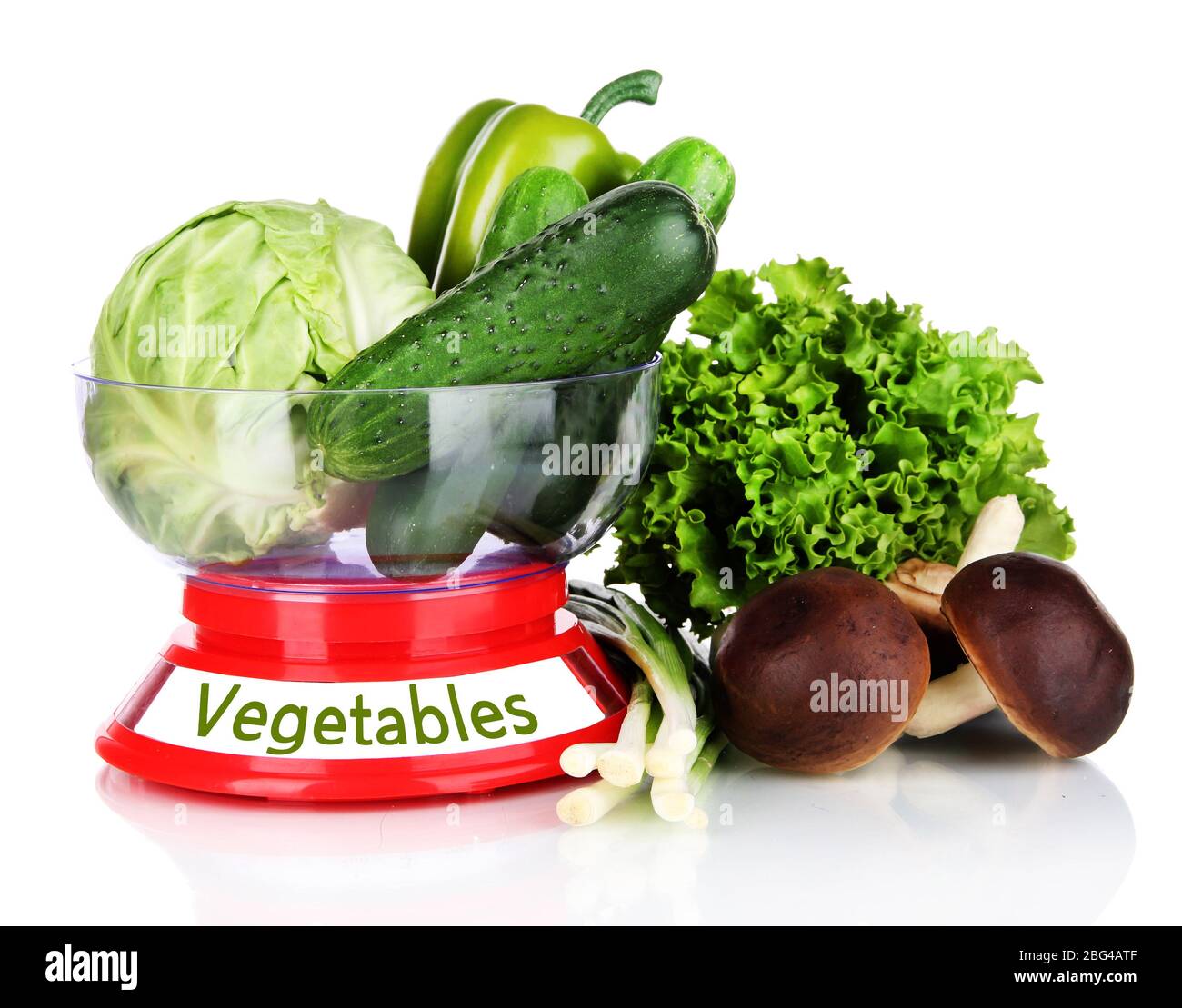 Fresh vegetables in scales isolated on white Stock Photo - Alamy