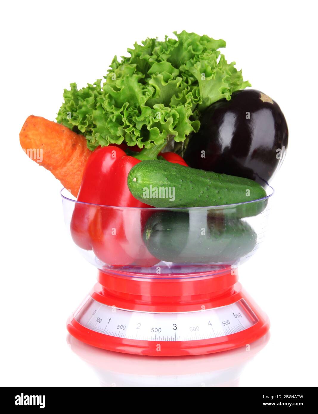 Fresh vegetables in scales isolated on white Stock Photo - Alamy