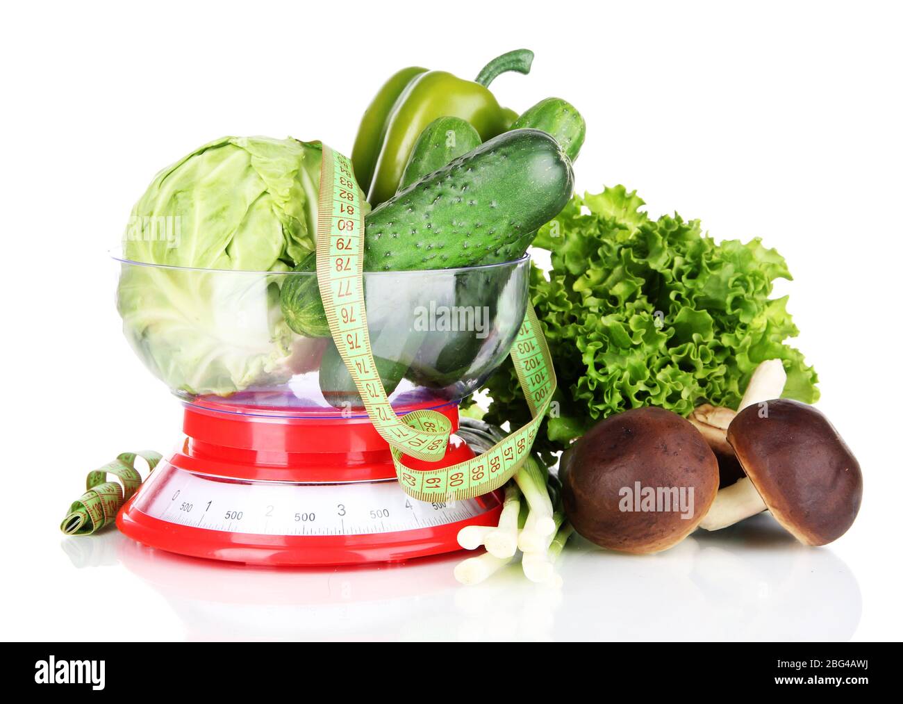 Fresh vegetables in scales isolated on white Stock Photo - Alamy