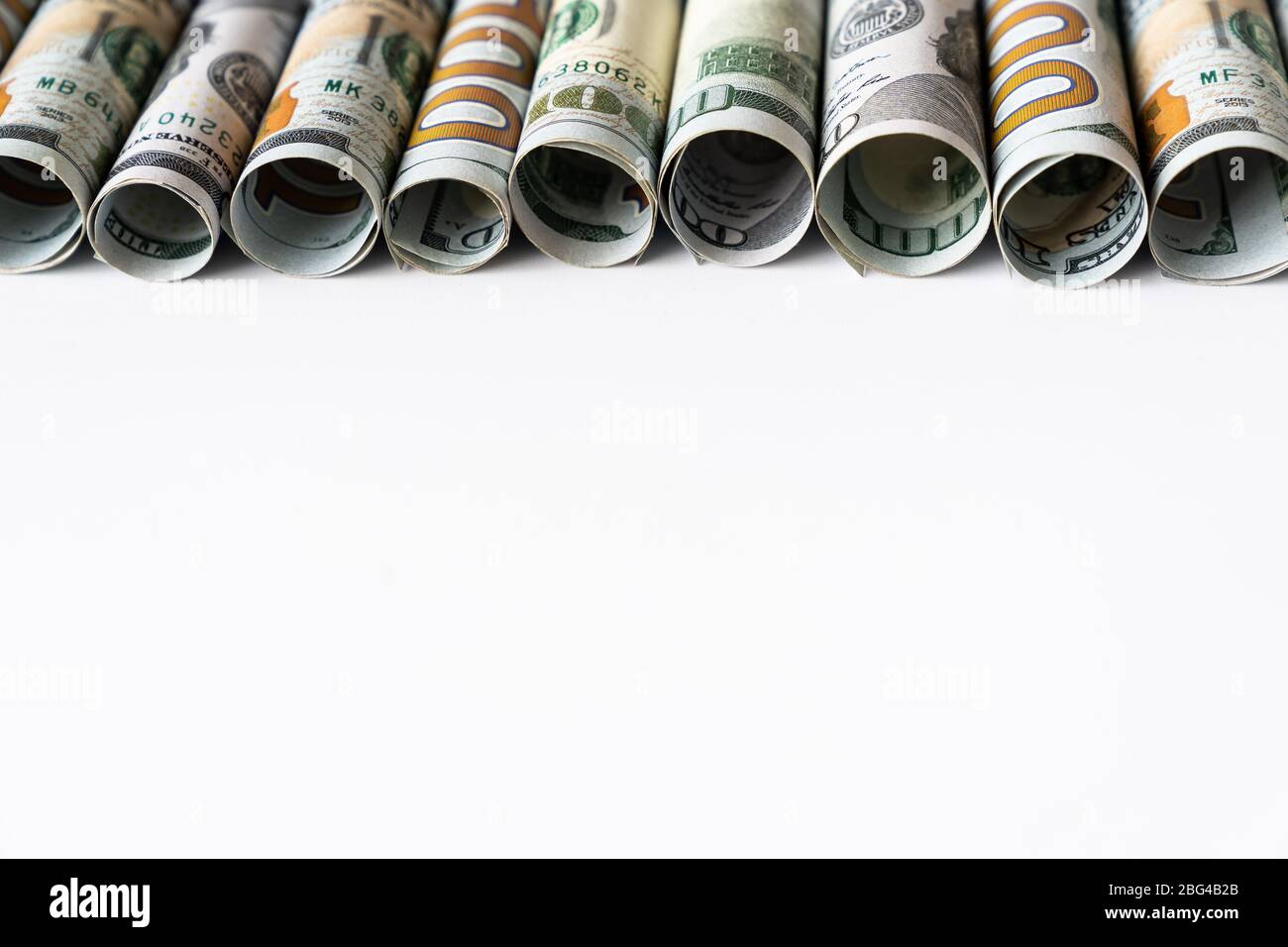 Rolls of US dollar bill in a row Stock Photo - Alamy