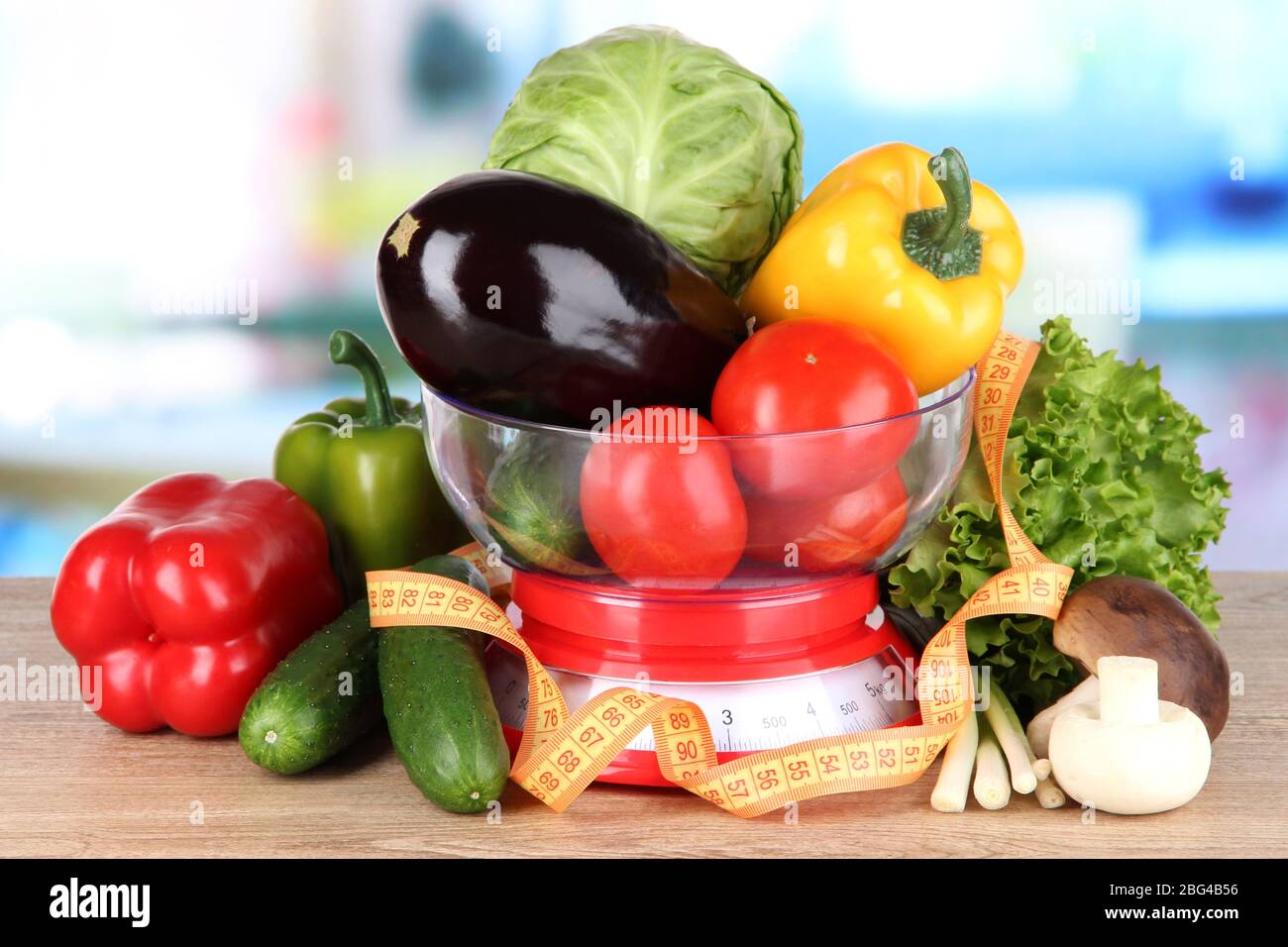 Fresh vegetables in scales on table in kitchen Stock Photo - Alamy