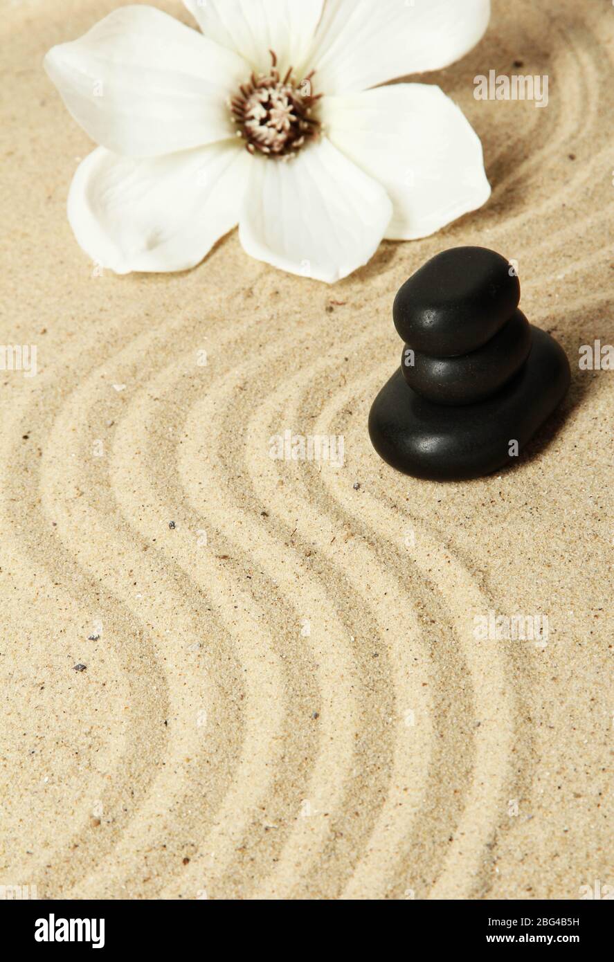 Zen garden with raked sand and round stones close up Stock Photo - Alamy