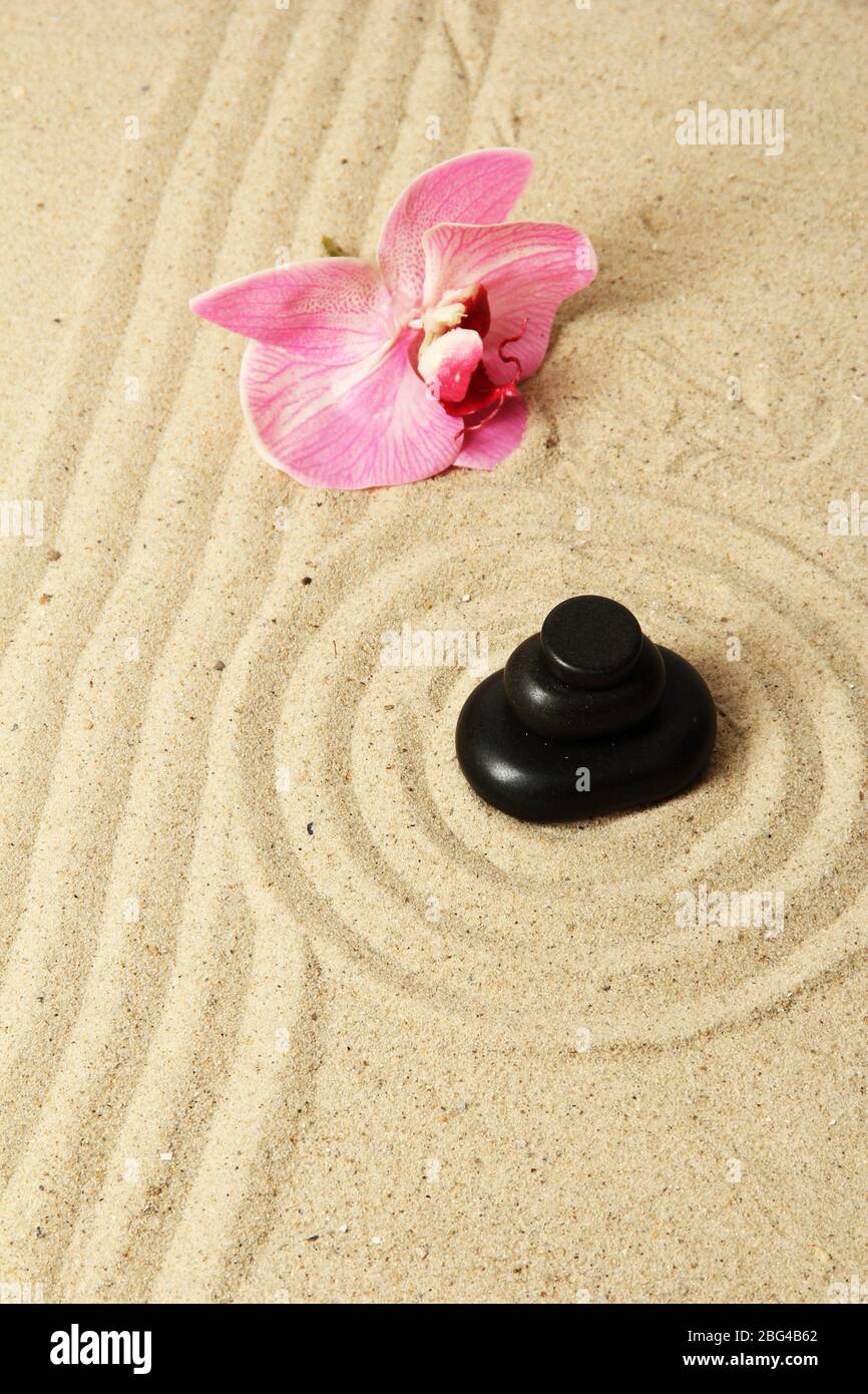 Zen garden with raked sand and round stones close up Stock Photo - Alamy