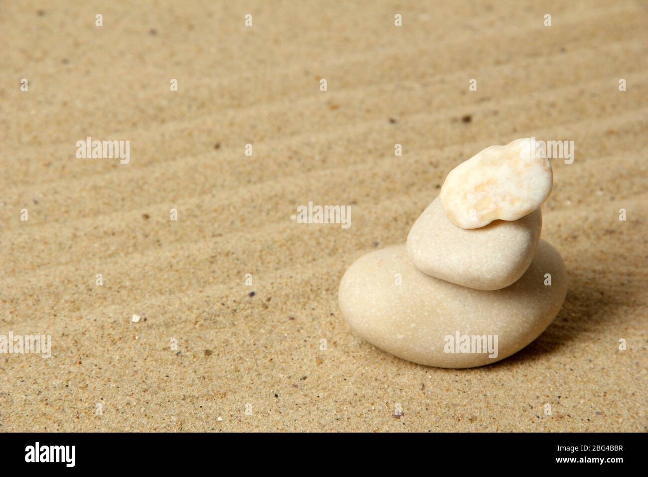 Zen garden with raked sand and round stones close up Stock Photo - Alamy