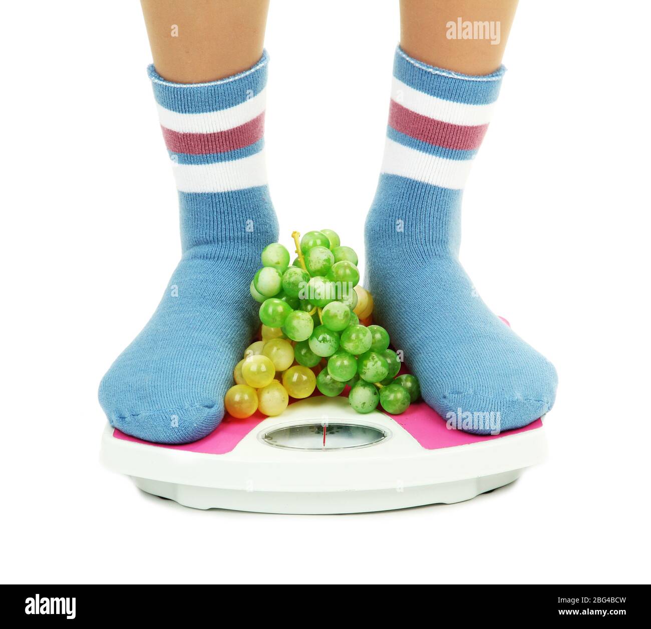 Female feet on scales, isolated on white Stock Photo - Alamy