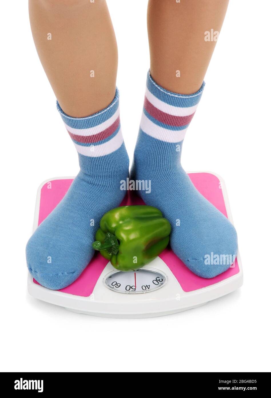 Female feet on scales, isolated on white Stock Photo - Alamy