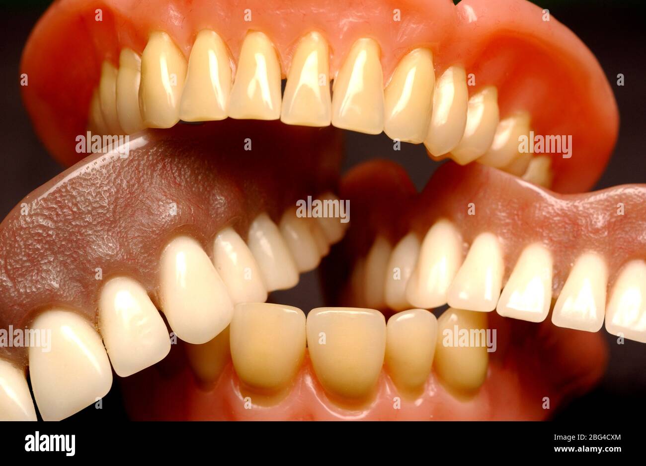 A collection of dentures piled on top of each other Stock Photo - Alamy