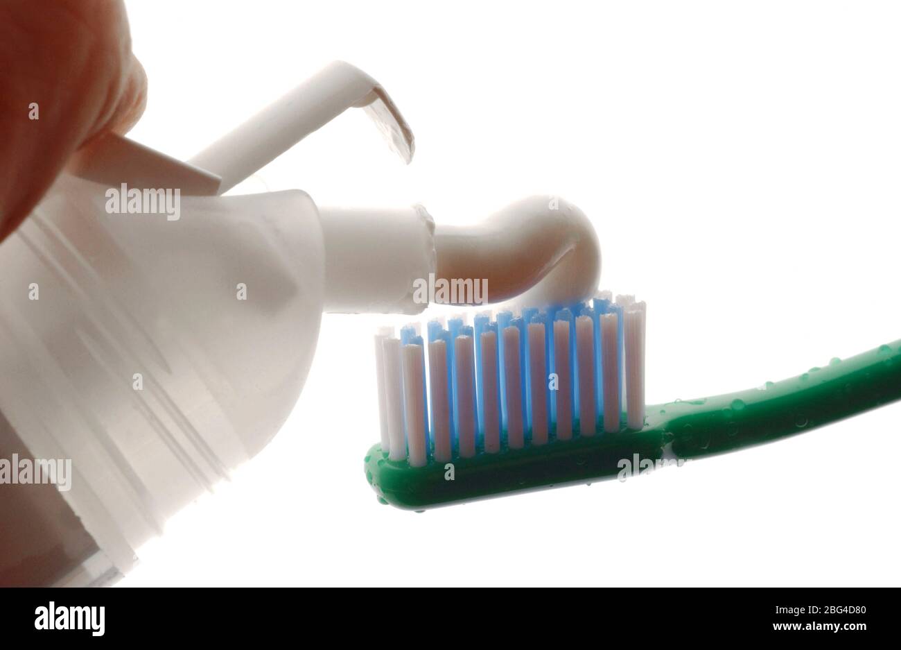 Squeezing Toothpaste Onto Toothbrush High Resolution Stock Photography ...