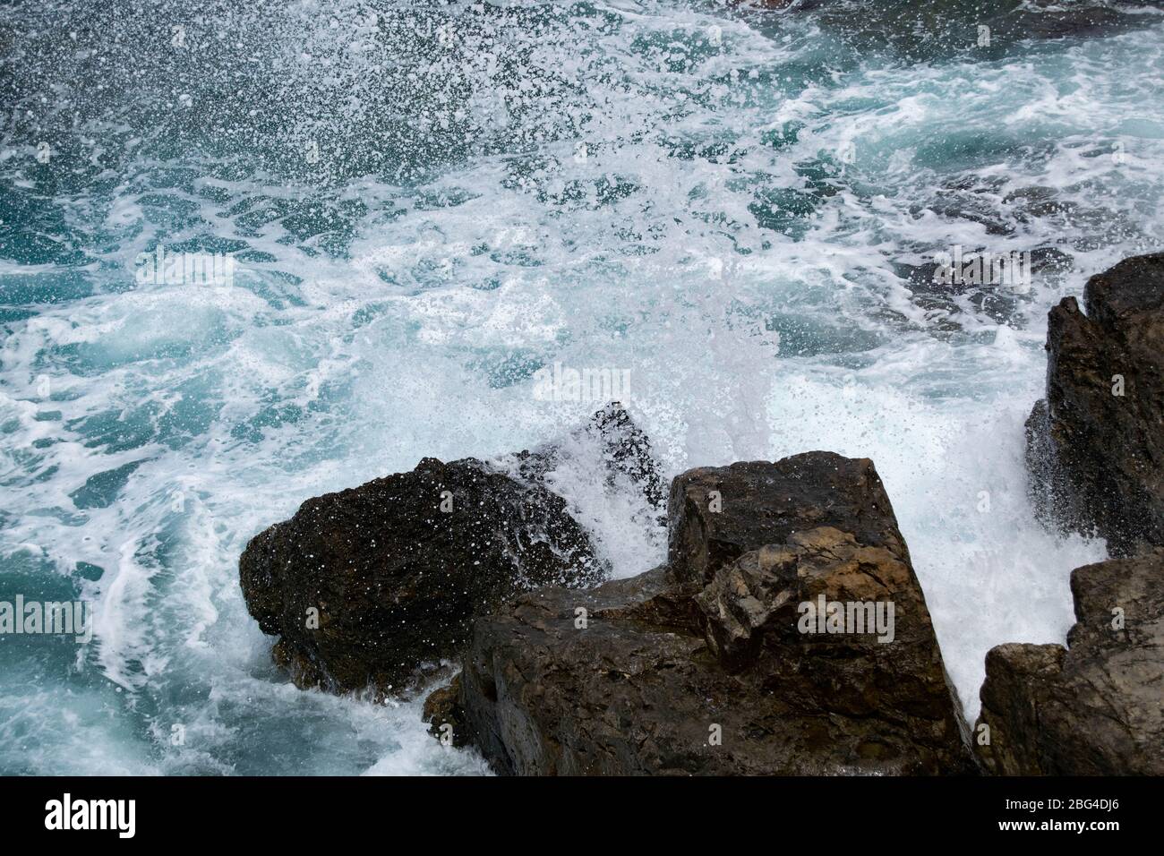 Waves breaking against rocks off the coast of the Greek island, Crete ...