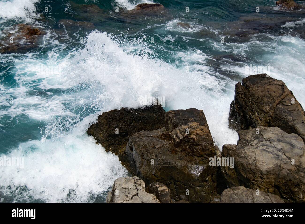 Waves breaking against rocks off the coast of the Greek island, Crete ...