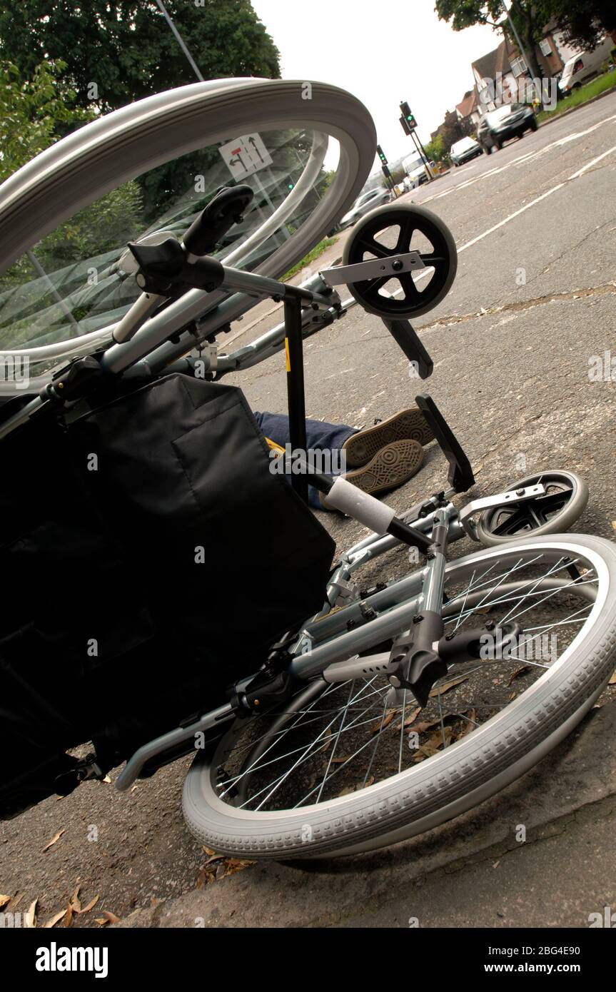 A young man laying on the floor after falling from his wheelchair Stock ...
