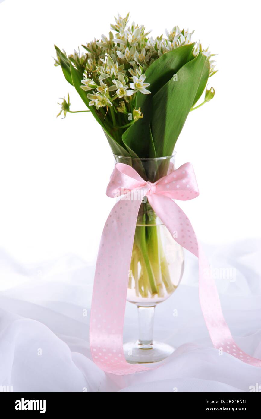 Spring flowers in glass on white background Stock Photo - Alamy