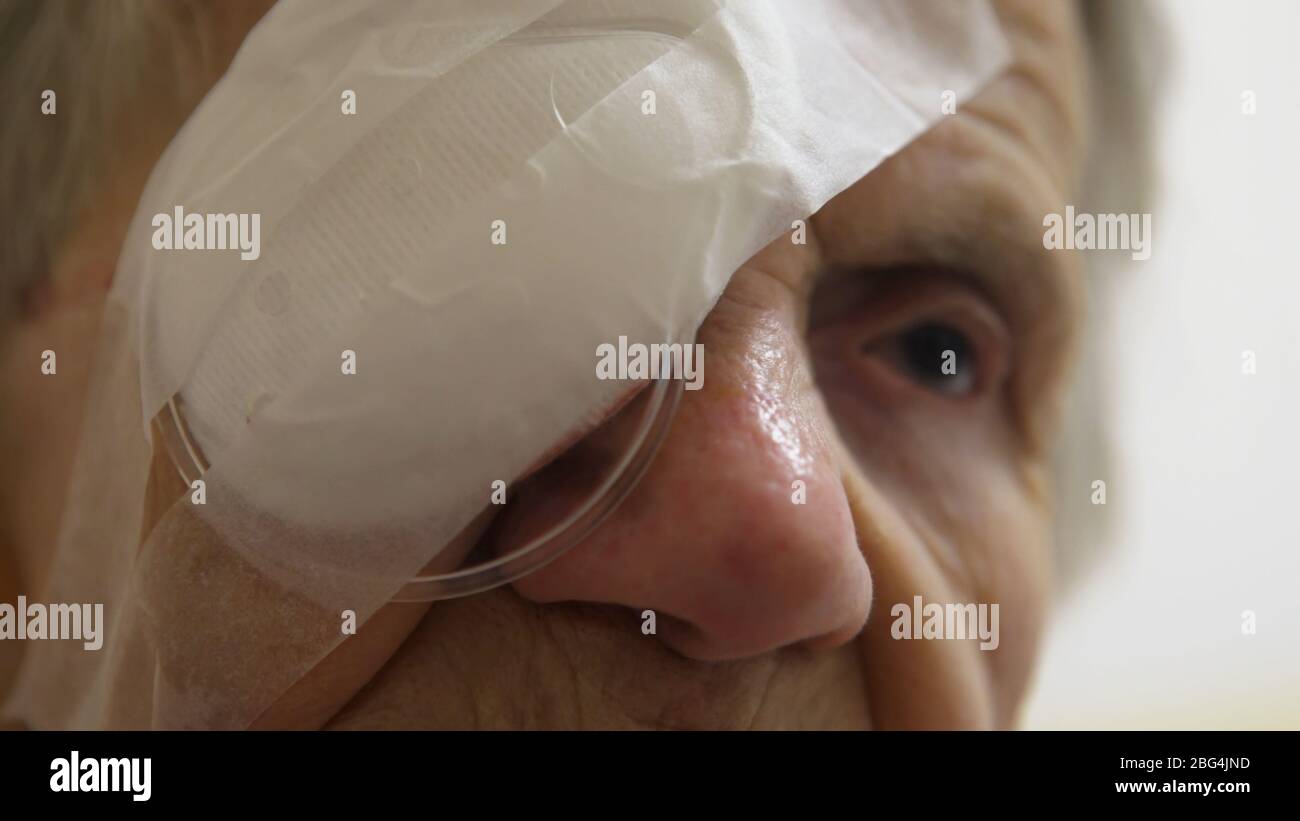 Old woman with protective eye patch after cataract surgery Stock Photo ...