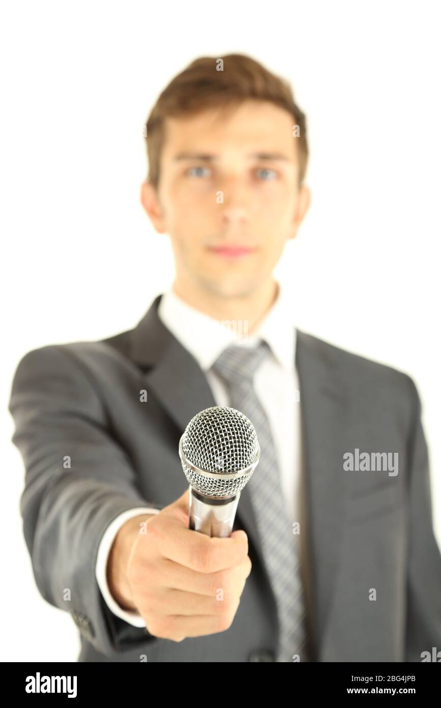 Young businessman talking with microphone, isolated on white Stock ...