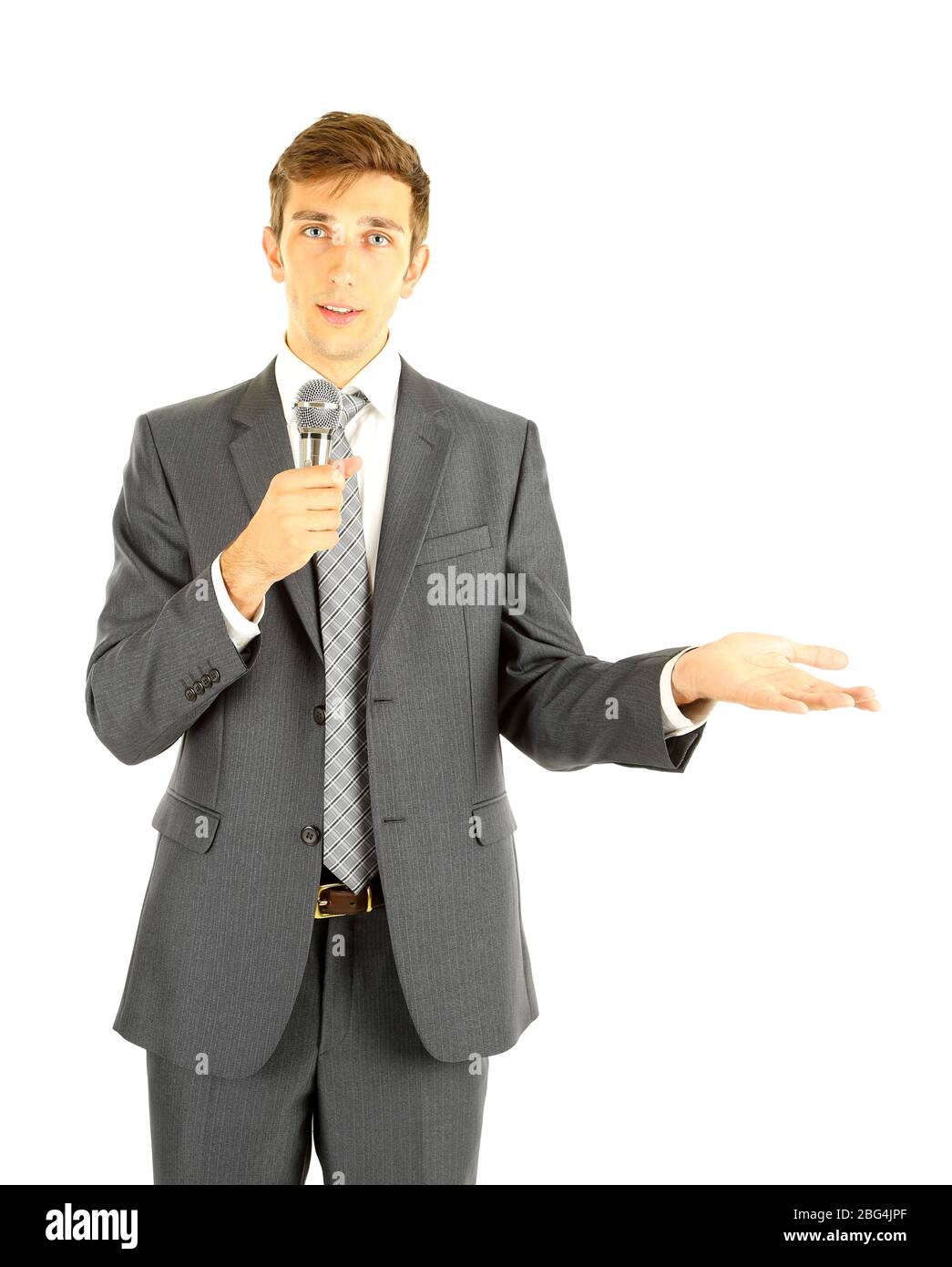 Young businessman talking with microphone, isolated on white Stock ...