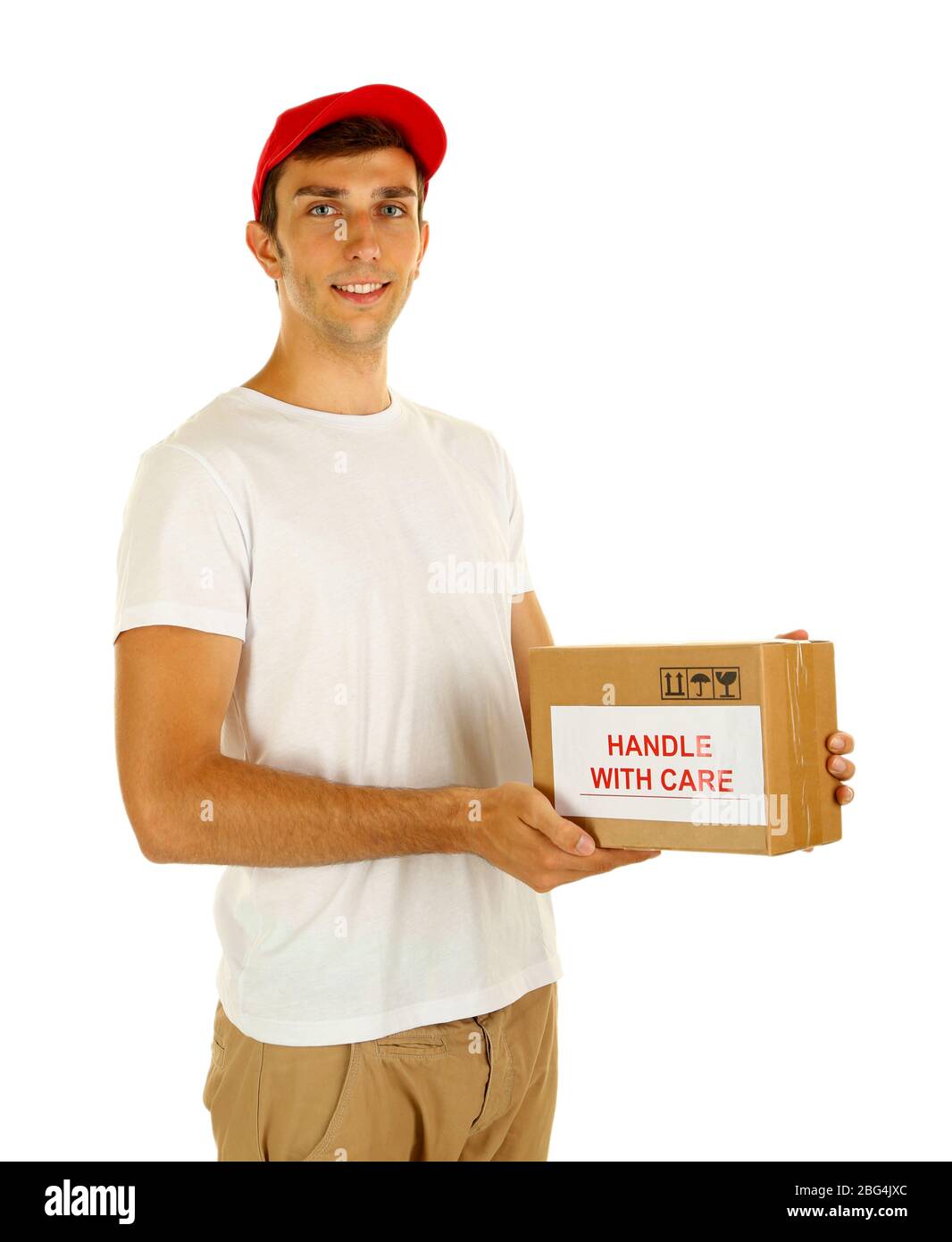 Young delivery man holding parcel, isolated on white Stock Photo - Alamy