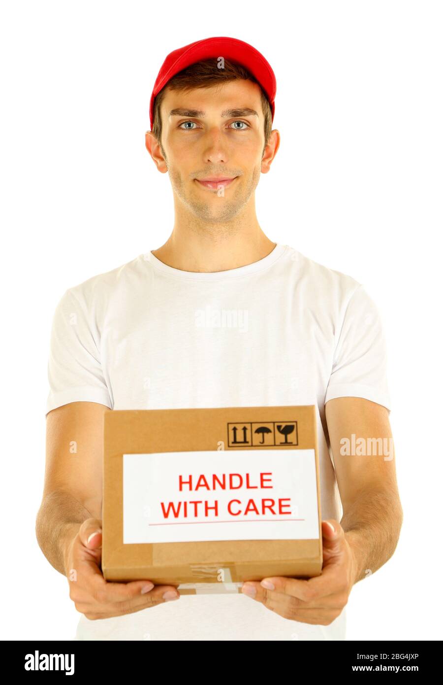Young delivery man holding parcel, isolated on white Stock Photo - Alamy
