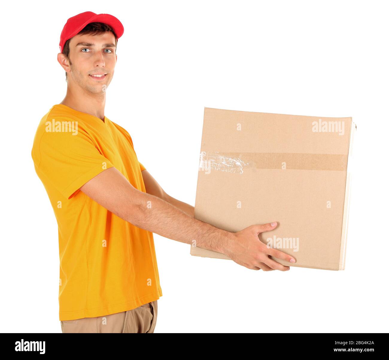 Young delivery man holding parcel, isolated on white Stock Photo - Alamy