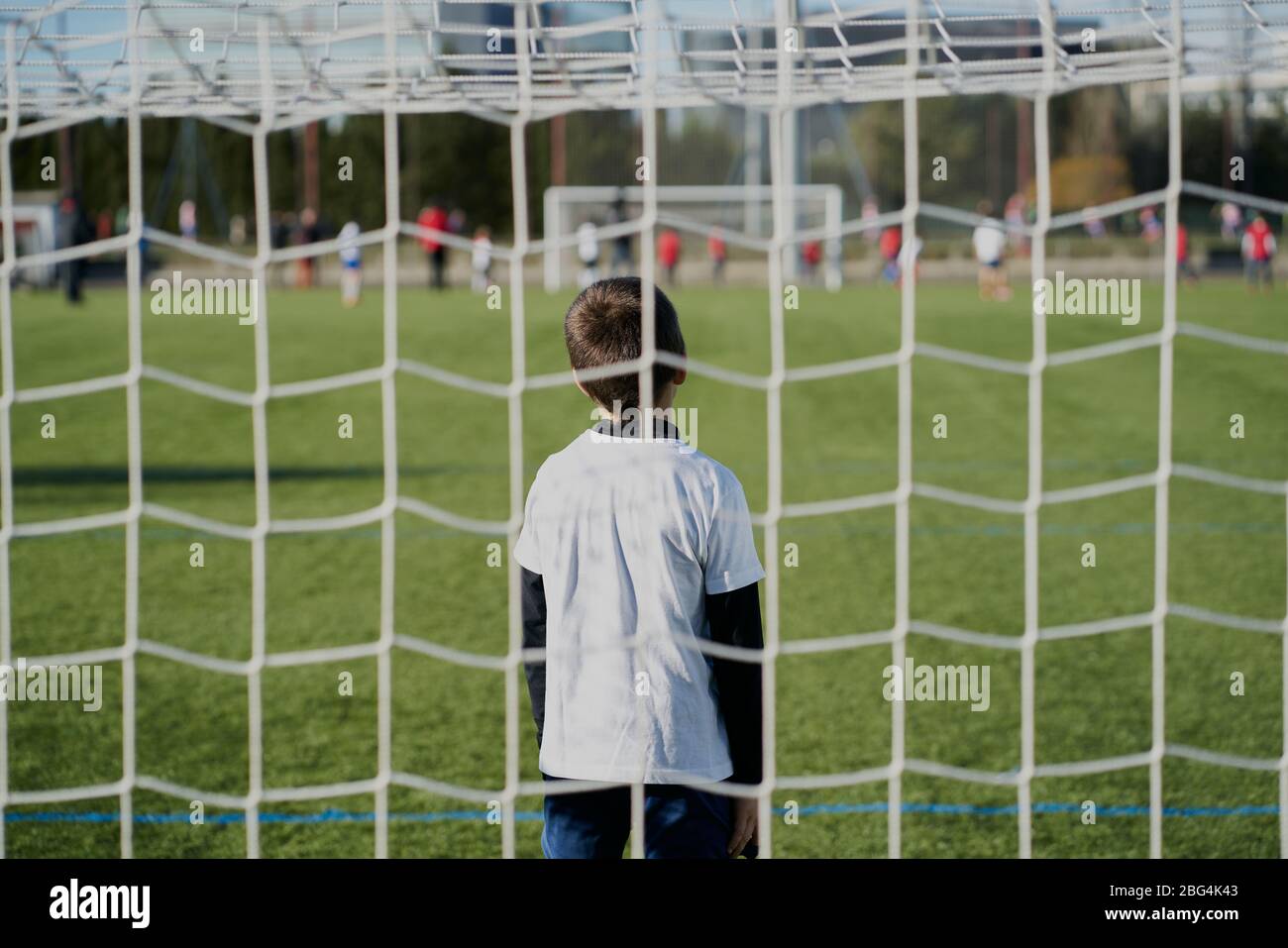 gatekeeper children soccer player in action. stadium Stock Photo - Alamy