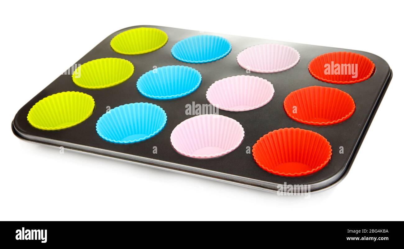 Muffin tray isolated on white Stock Photo - Alamy