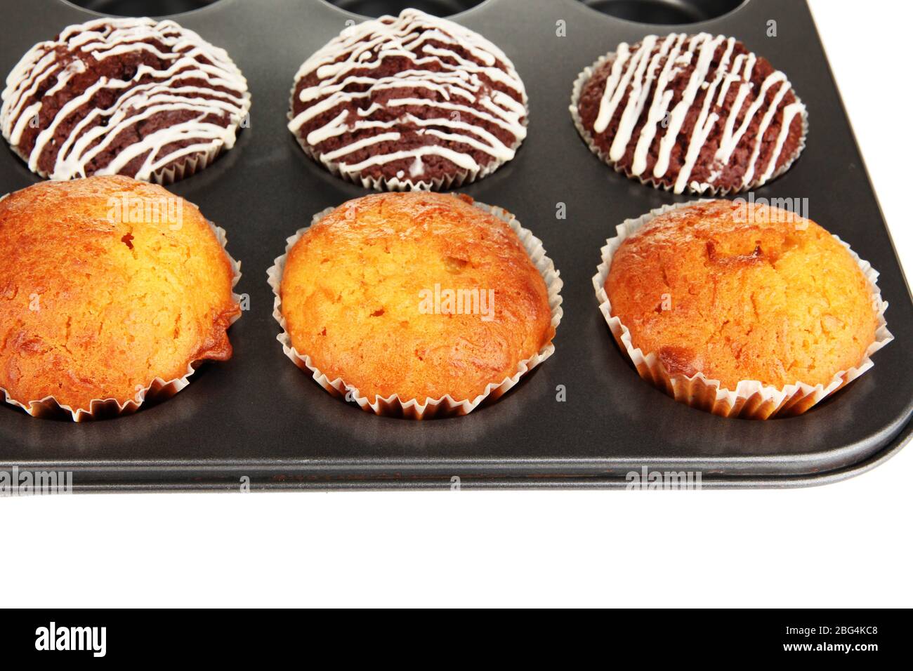 Tasty muffin cakes in baking tray close up Stock Photo - Alamy