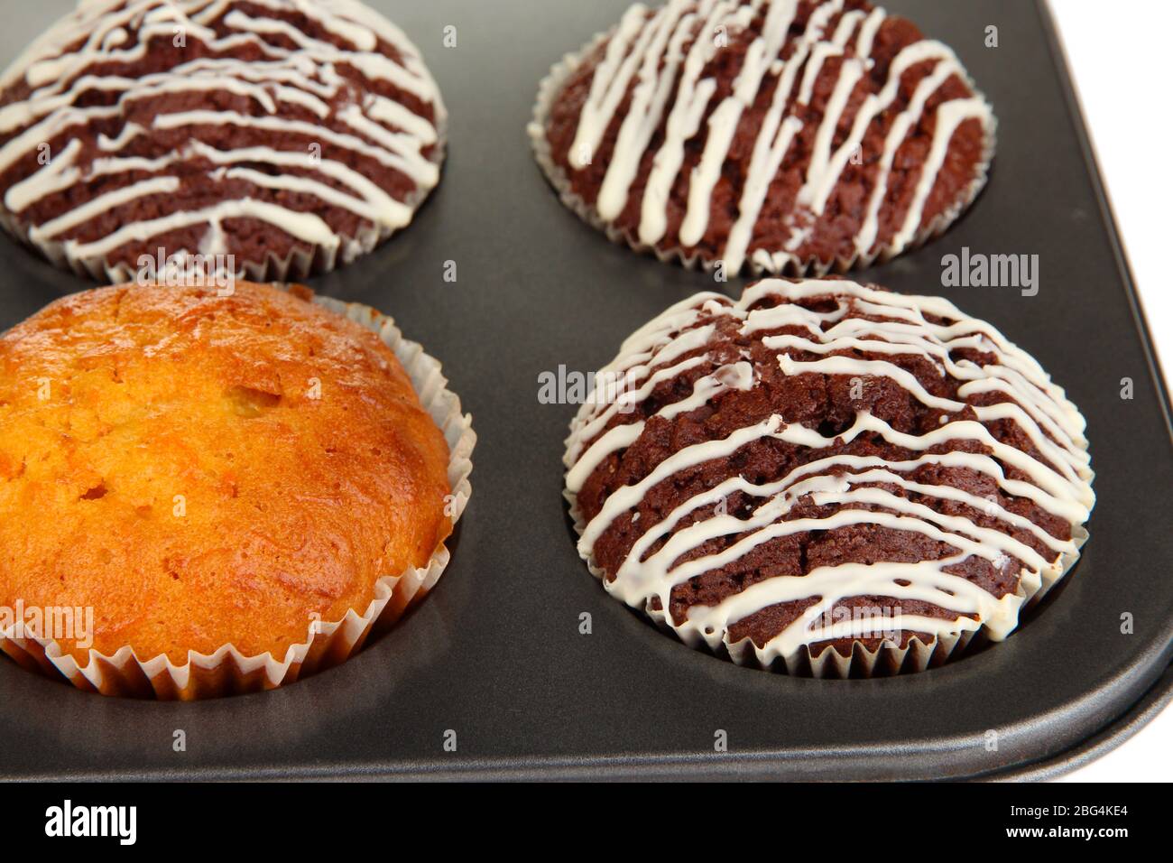 Tasty muffin cakes in baking tray close up Stock Photo - Alamy
