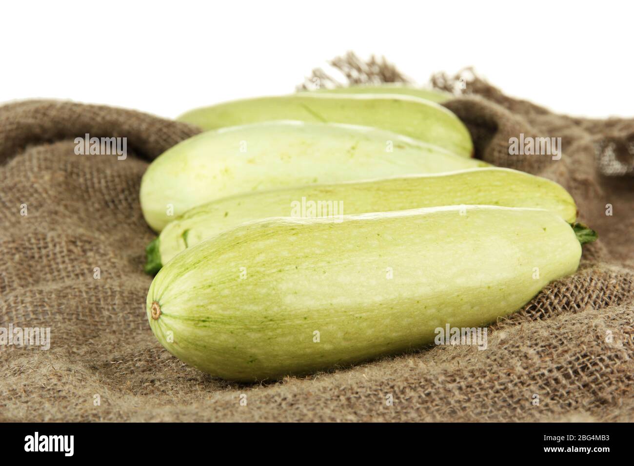 Fresh marrows on sackcloth, isolated on white Stock Photo - Alamy