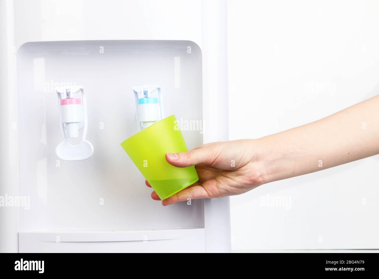 Woman filling plastic cup hi-res stock photography and images - Alamy