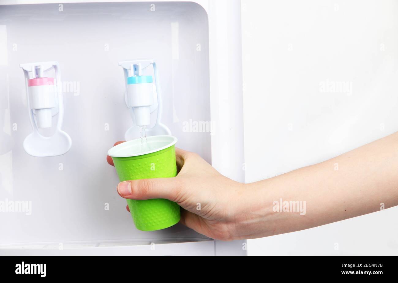 Woman filling plastic cup hi-res stock photography and images - Alamy