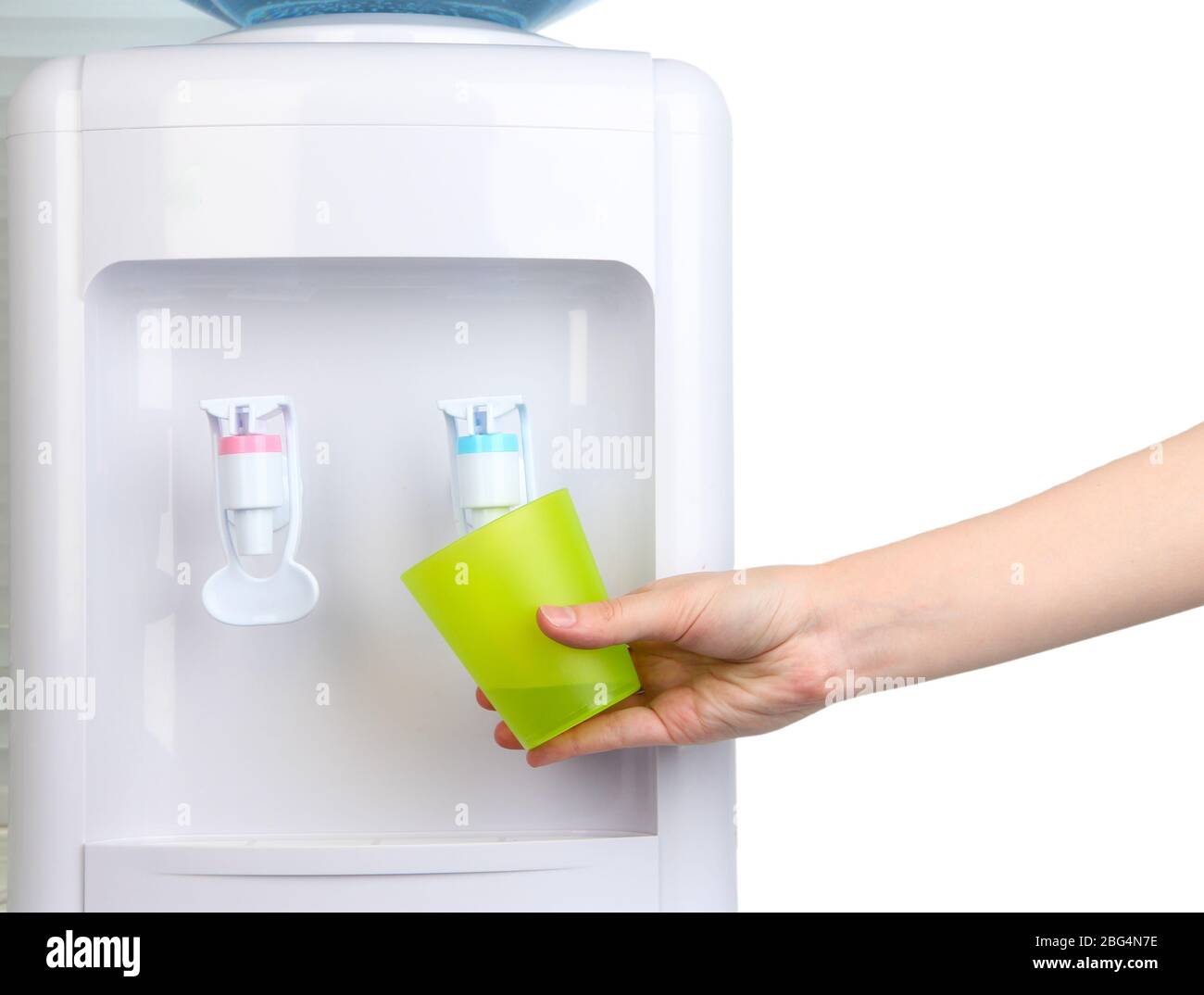 Woman filling cup at water cooler Stock Photo - Alamy