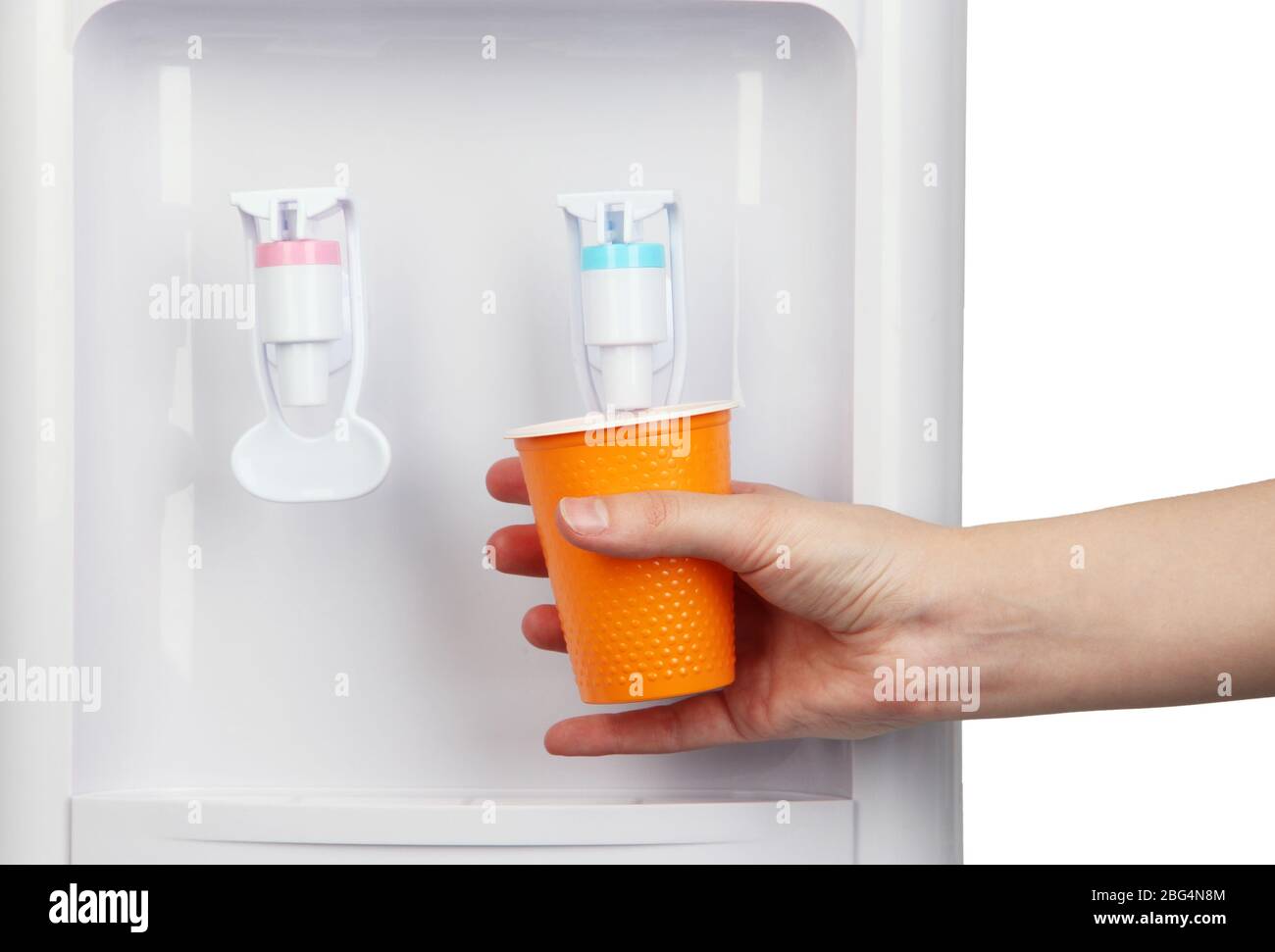 Woman filling cup at water cooler Stock Photo - Alamy