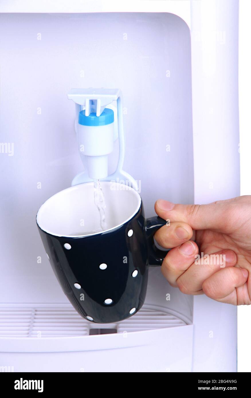 Woman filling cup at water cooler Stock Photo - Alamy