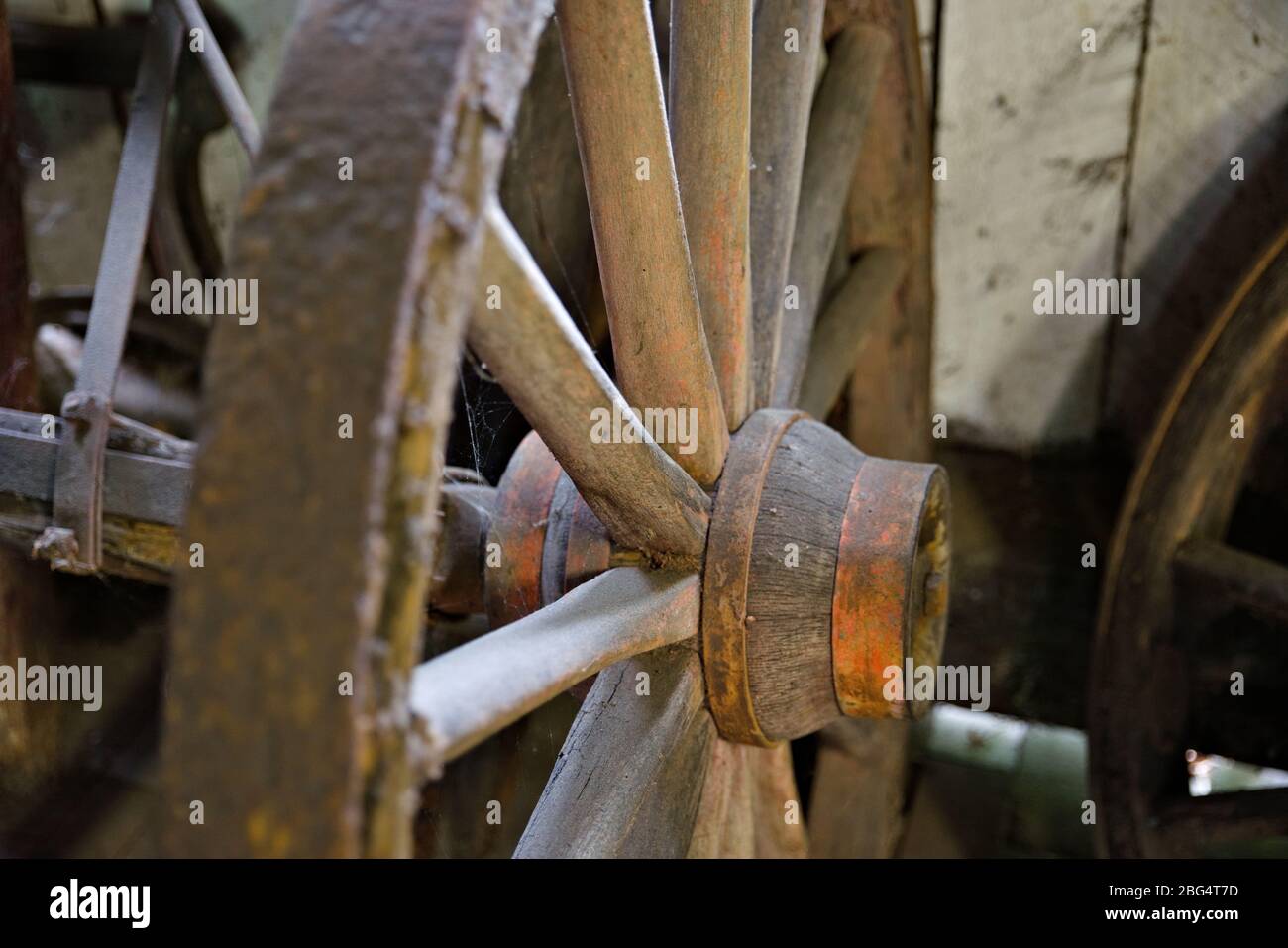 Old, weathered wooden wagon wheels in a barn Stock Photo - Alamy
