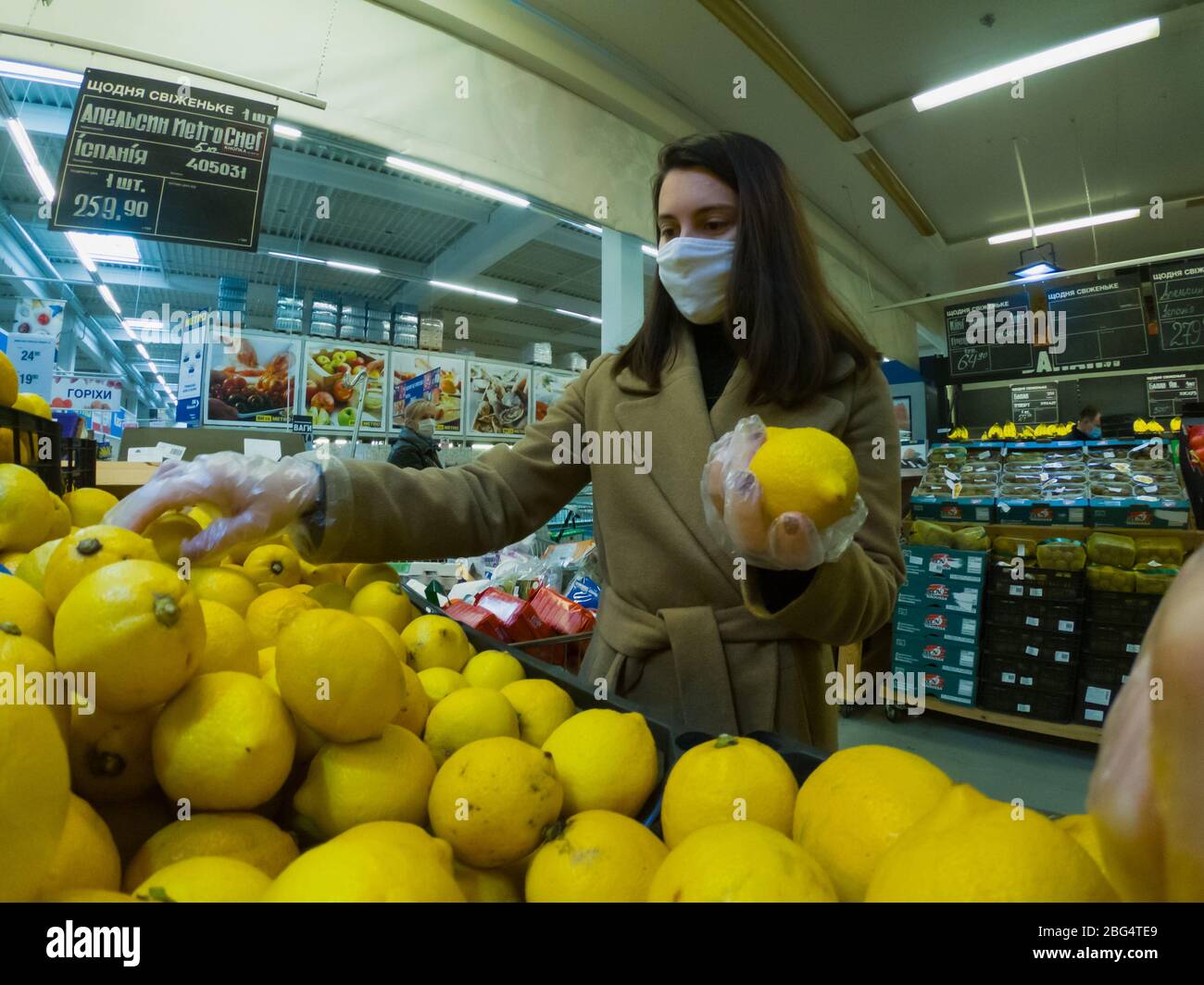 Lviv, Ukraine - March 10, 2020: young women in mask at grocery store ...