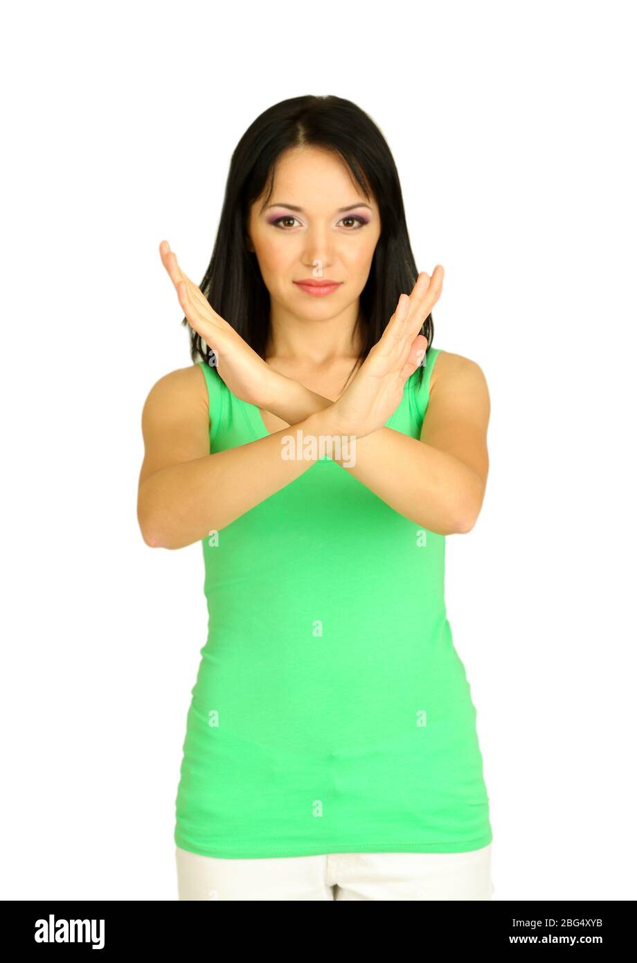 Girl showing stop sign on grey background Stock Photo - Alamy