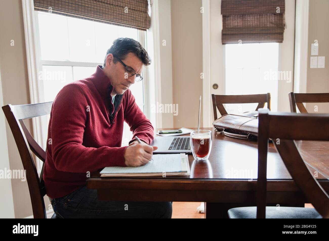 Working at the dining table hi-res stock photography and images - Alamy