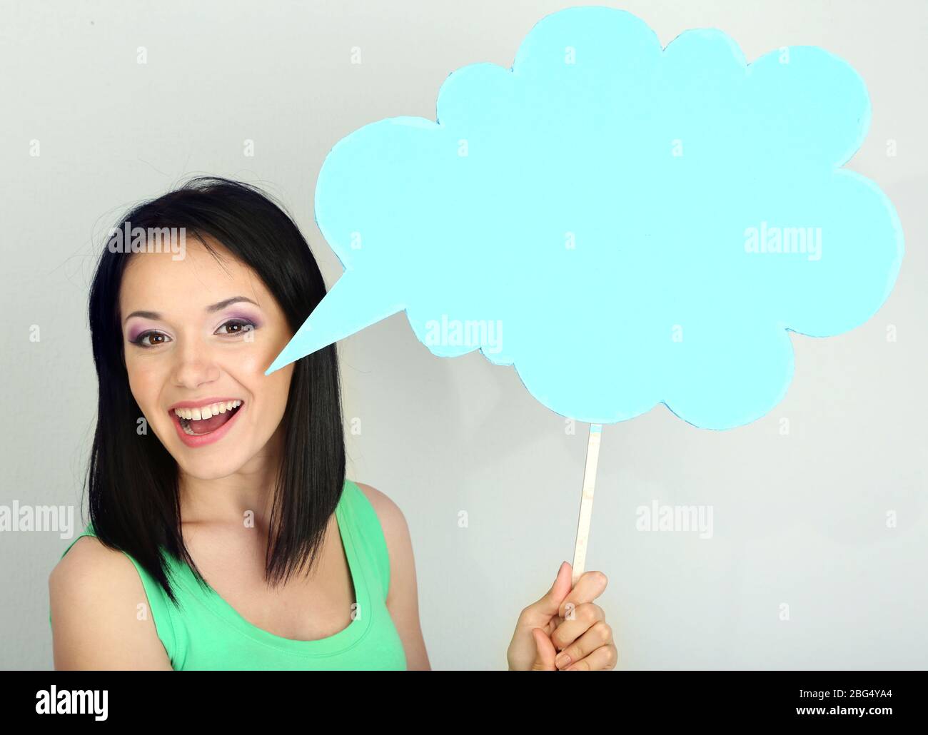 Thought girl in bubble next to it on grey background Stock Photo - Alamy