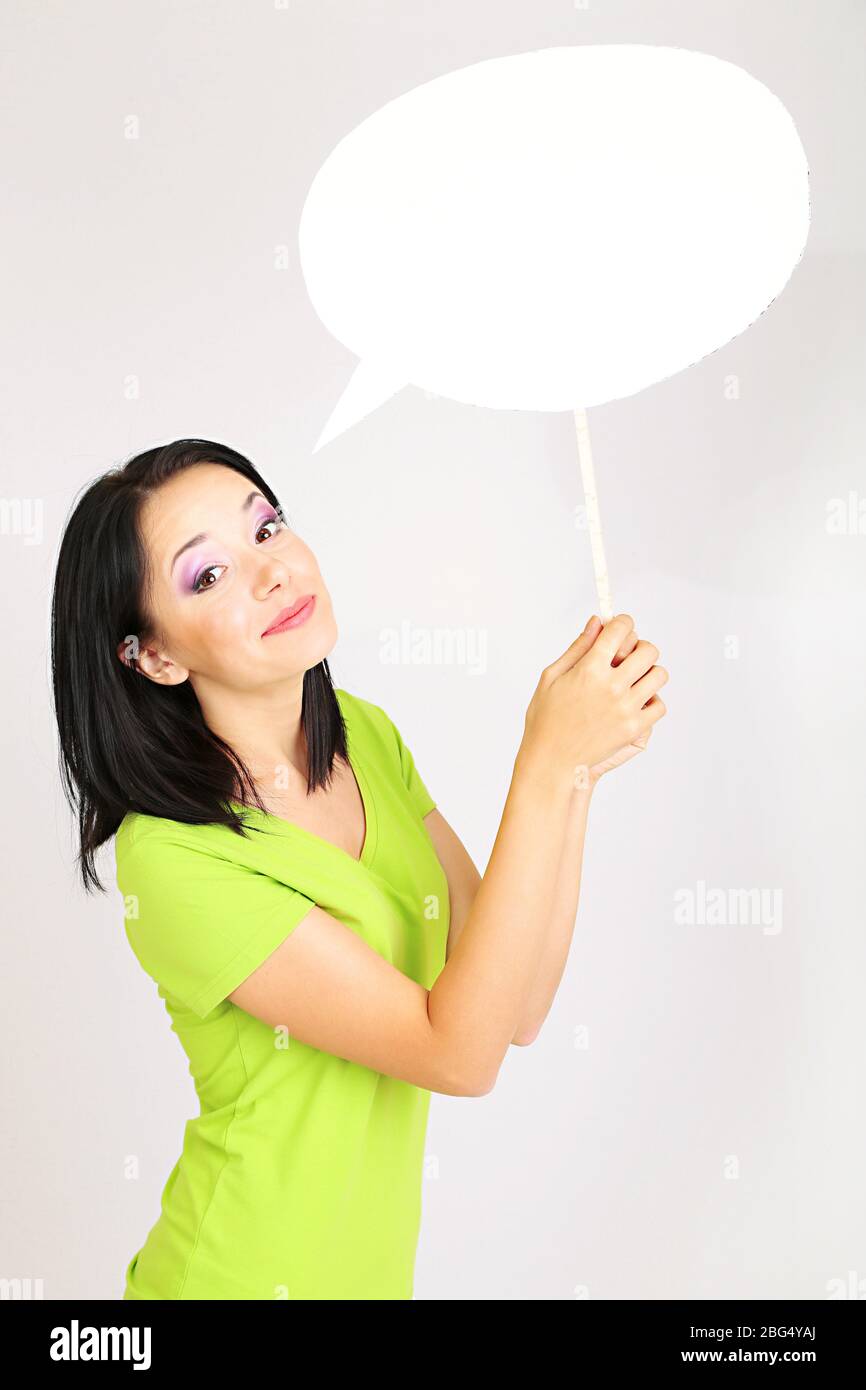 Thought girl in bubble next to it on grey background Stock Photo - Alamy