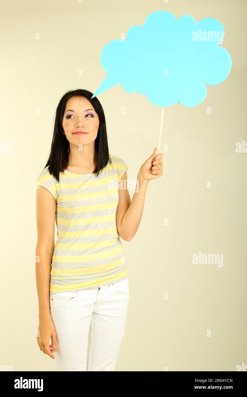Thought girl in bubble next to it on grey background Stock Photo - Alamy