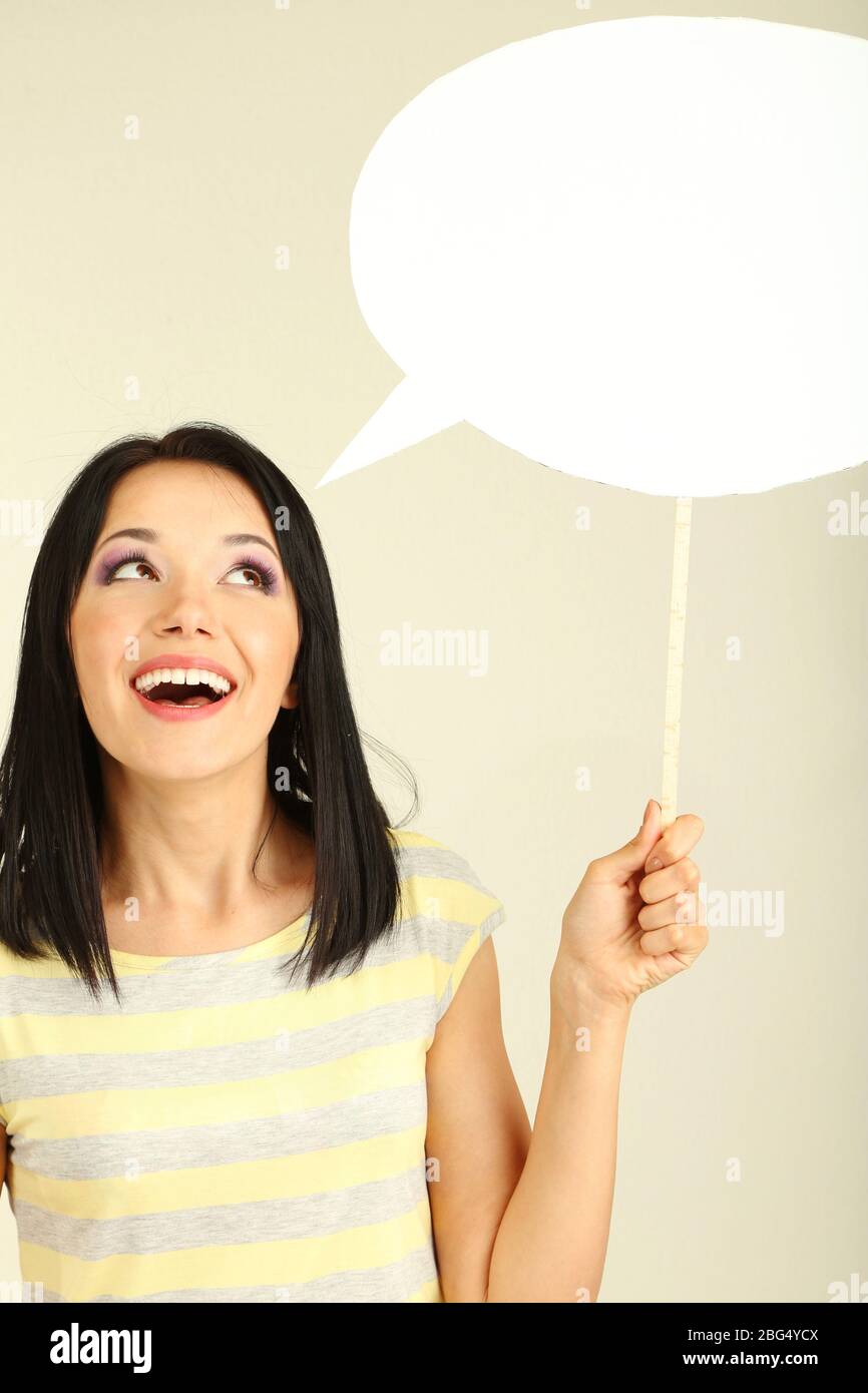 Thought girl in bubble next to it on grey background Stock Photo - Alamy