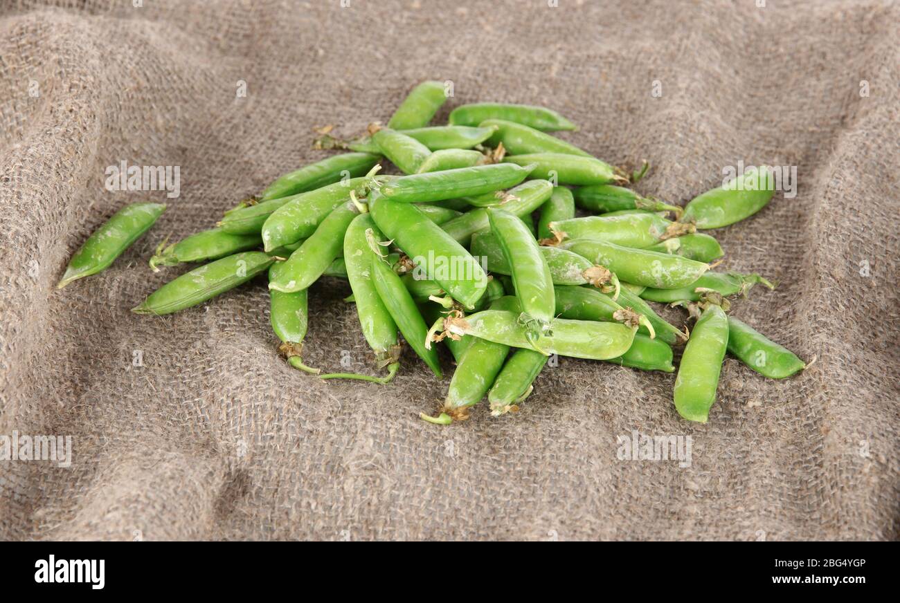 Green peas on bagging background Stock Photo - Alamy
