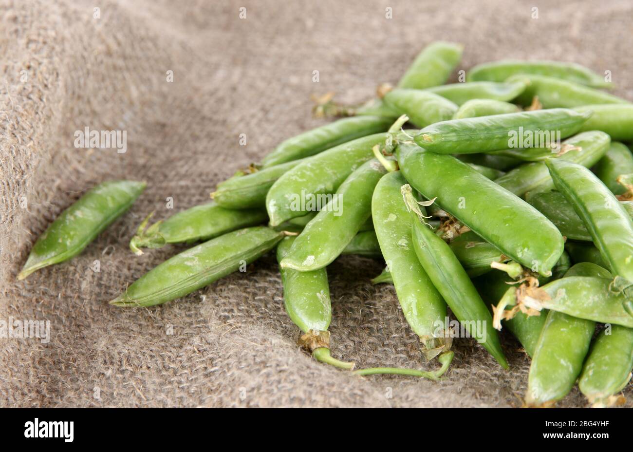 Green peas on bagging background Stock Photo - Alamy