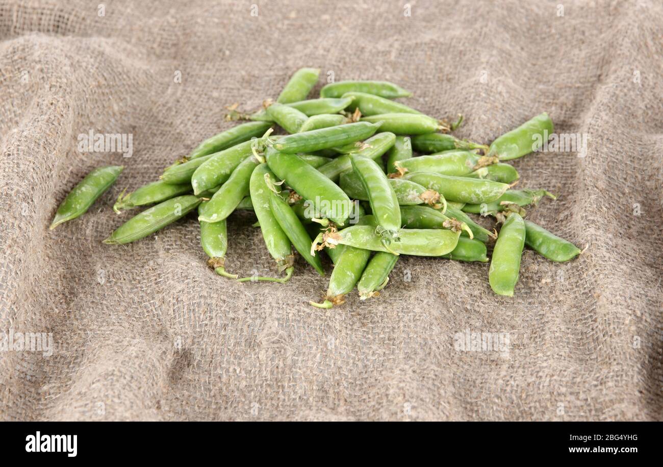 Green peas on bagging background Stock Photo - Alamy