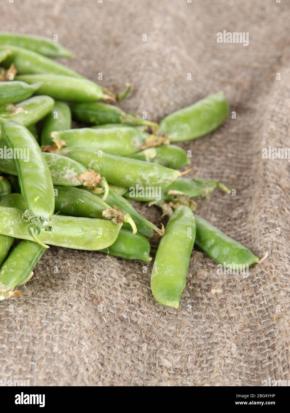 Green peas on bagging background Stock Photo - Alamy
